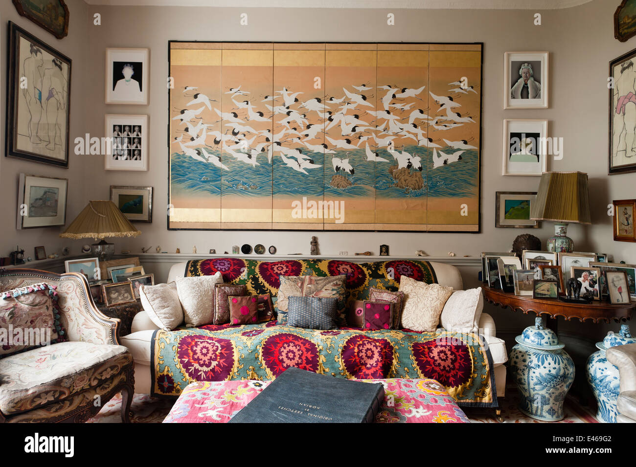 A large Japanese screen on wall above an Ottoman sofa from George Smith ...