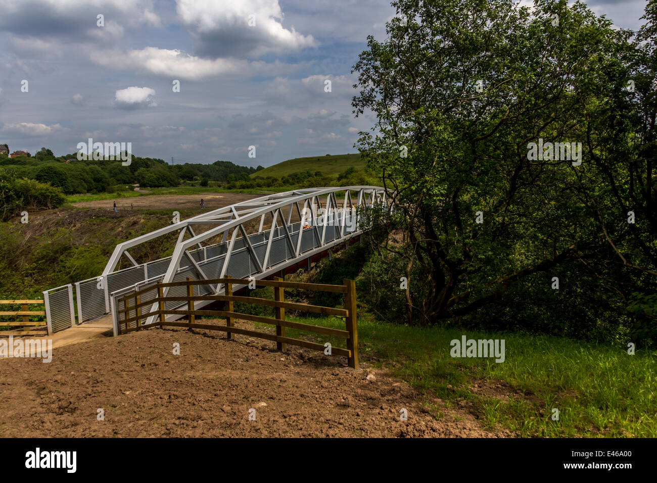 Metal footbridge over a small canal/river Stock Photo - Alamy