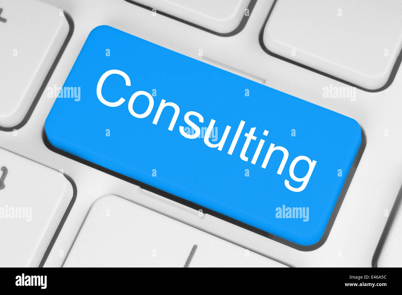 Blue consulting button on white keyboard Stock Photo - Alamy