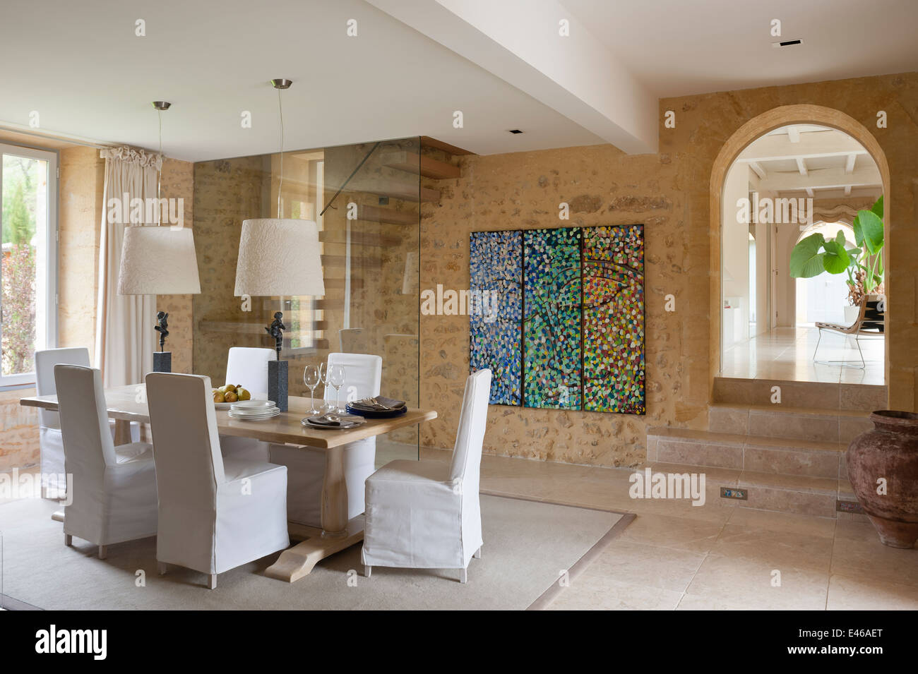 dining room with abstract painting on the wall, and dining table with ...