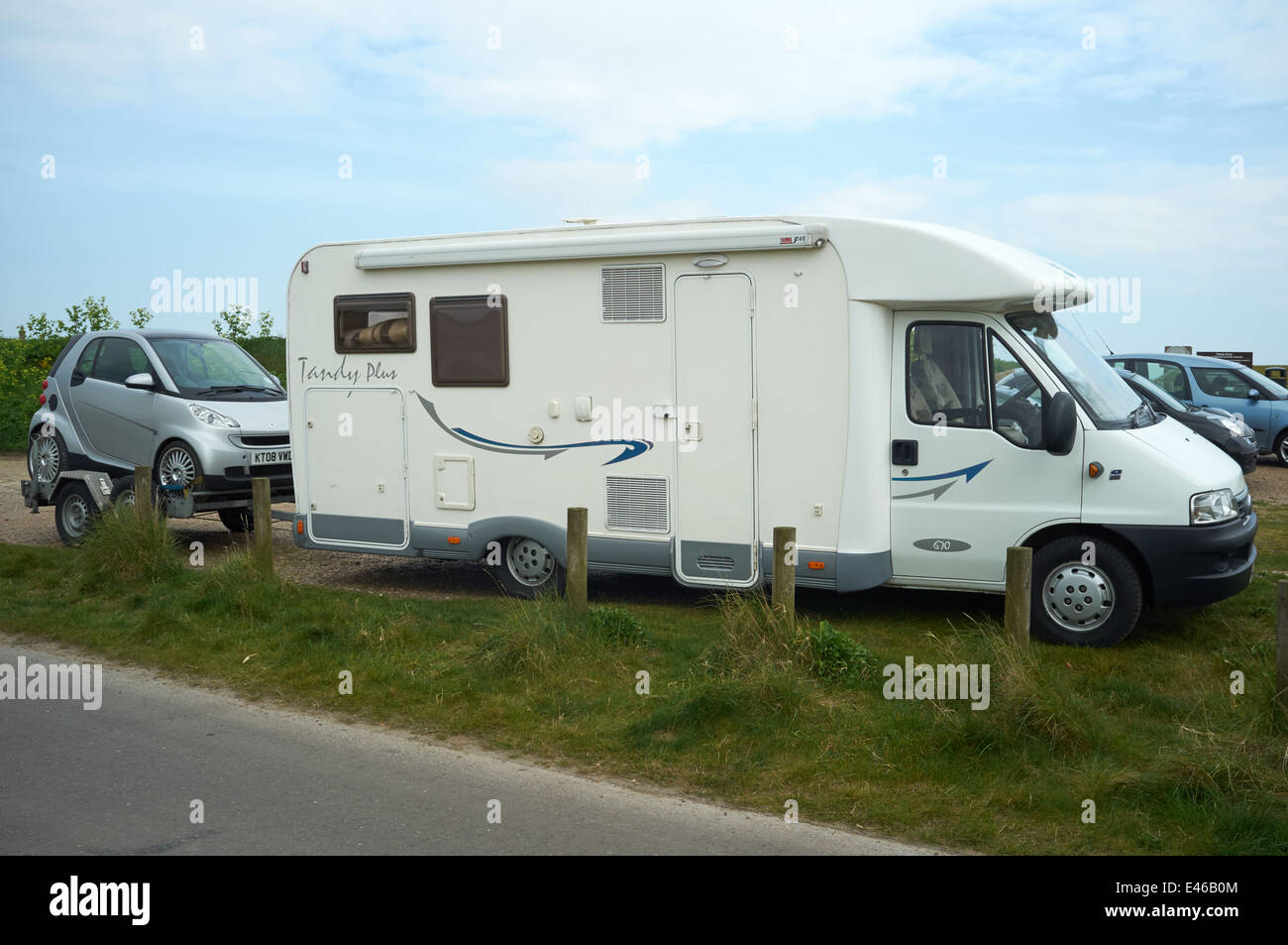 Motorhome & with Smart car on trailer Stock Photo - Alamy