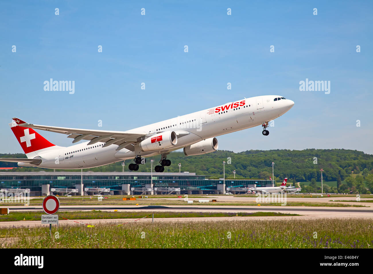 ZURICH - MAY 24: A-340 leaving Zurich airport for intercontinental ...