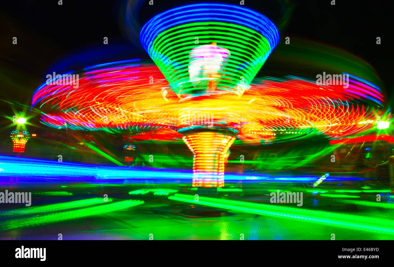 Rotating carousel in the fun park Stock Photo - Alamy