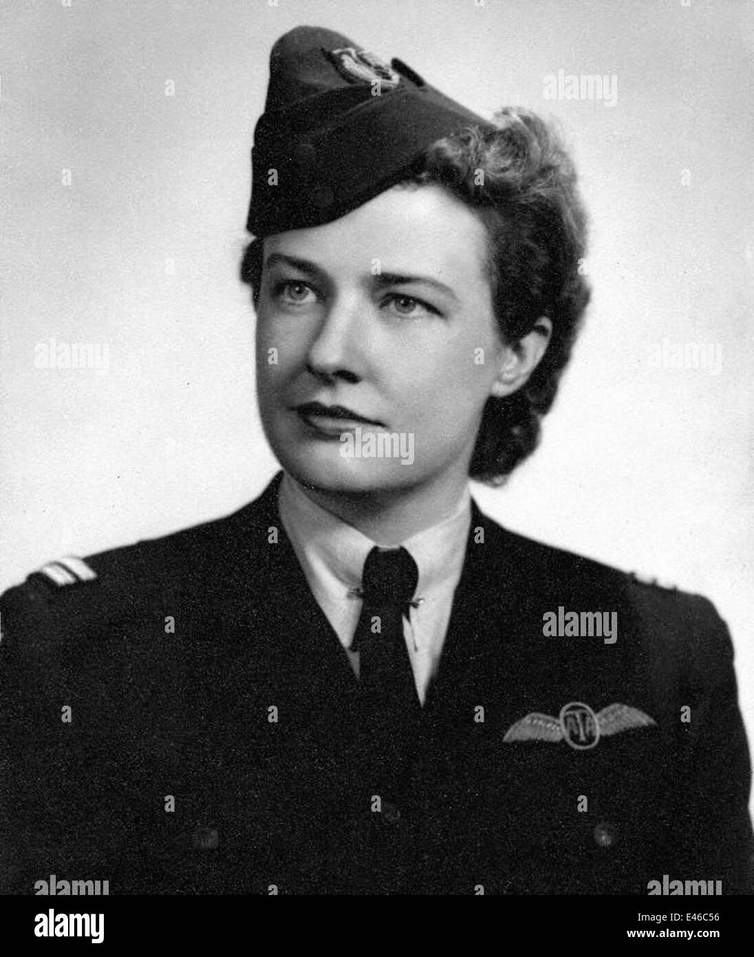 A photograph of a female aviator wearing a pilot uniform, complete with ...