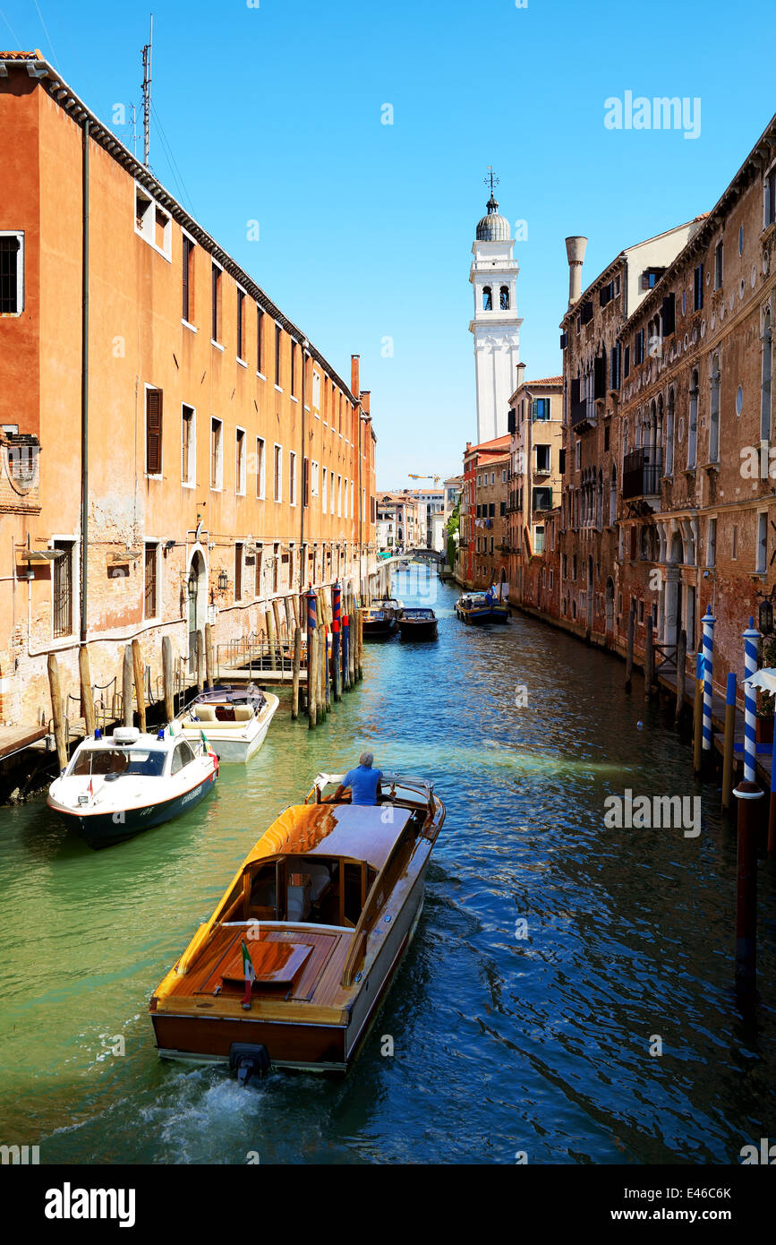 The water taxi with tourists is on water channel, Venice, Italy Stock ...