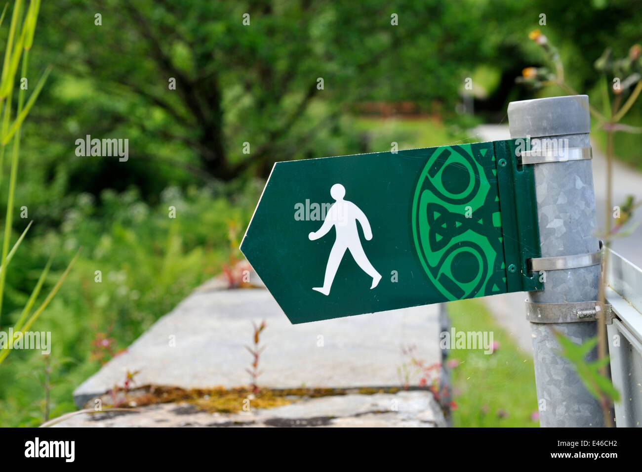 Walking route sign with parts of Celtic note in design, Wales, UK Stock ...