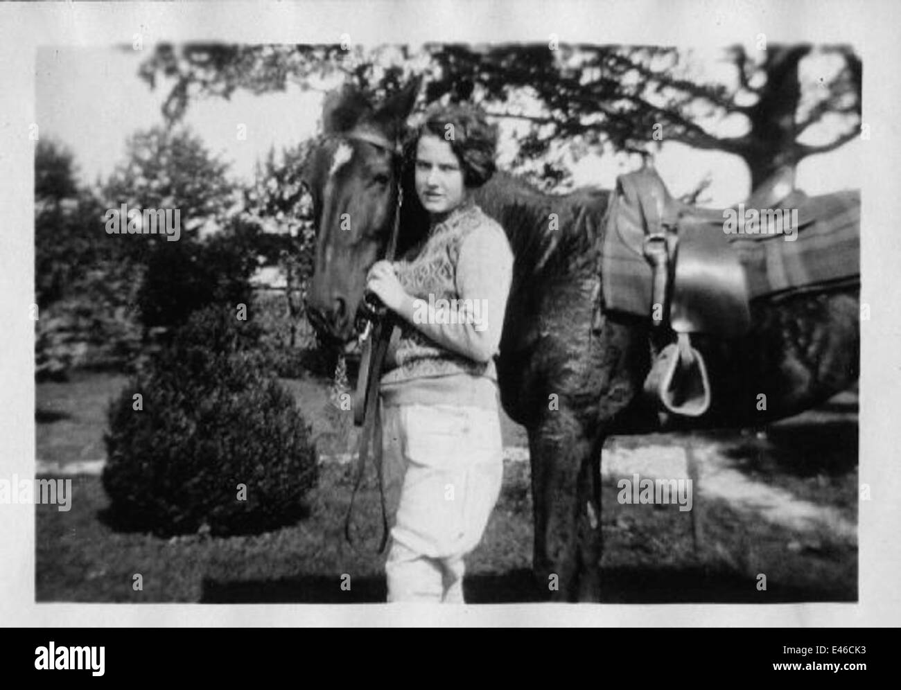 This photograph depicts Helen Richey, a pioneering aviator, standing ...