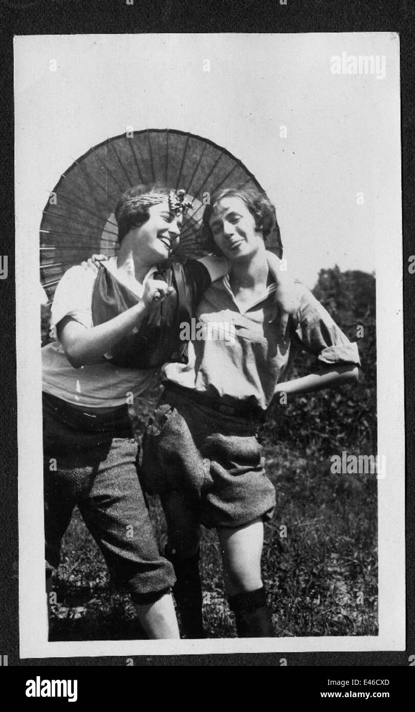 This photograph captures Helen Richey outdoors with a parasol, smiling ...