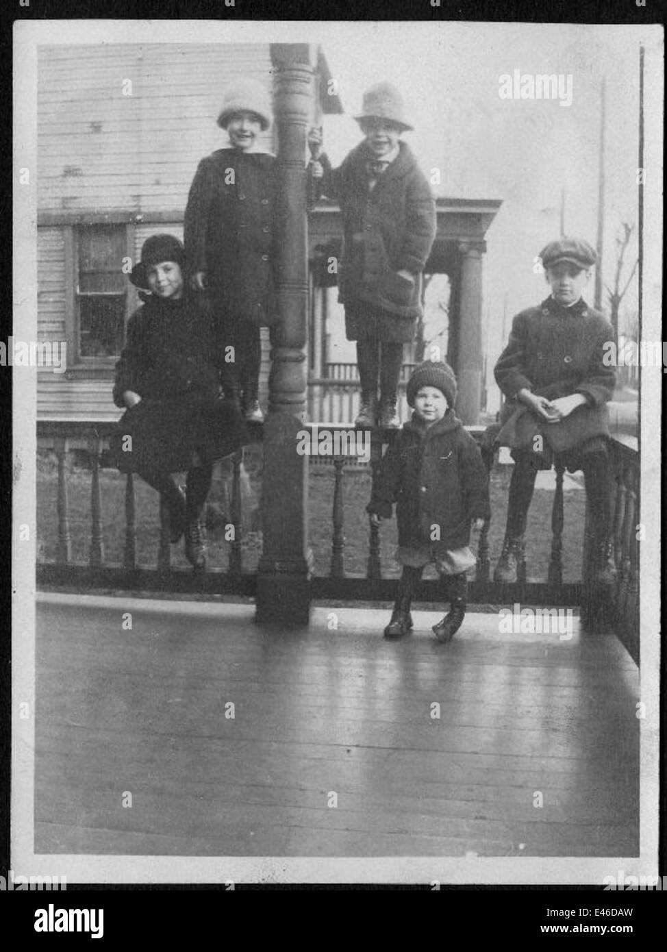 This image depicts Helen Richey with children on a porch during winter ...
