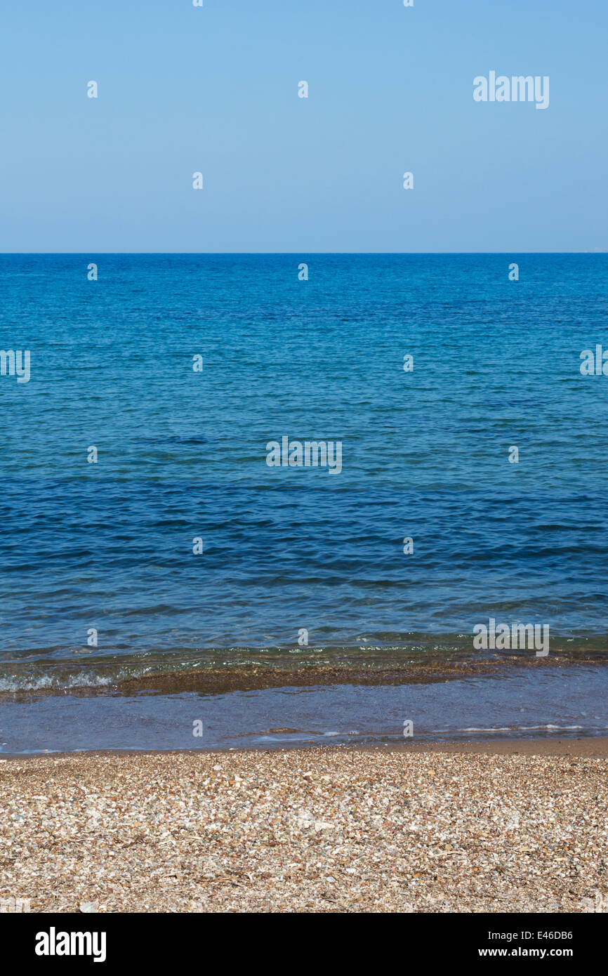 Blue sea and small pebbled beach. Cyprus Stock Photo - Alamy