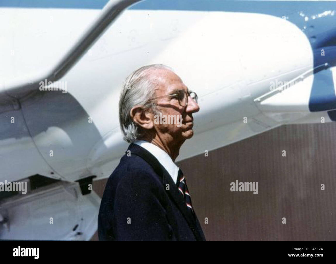 This photograph, labeled HC165, depicts a historic aircraft in flight ...