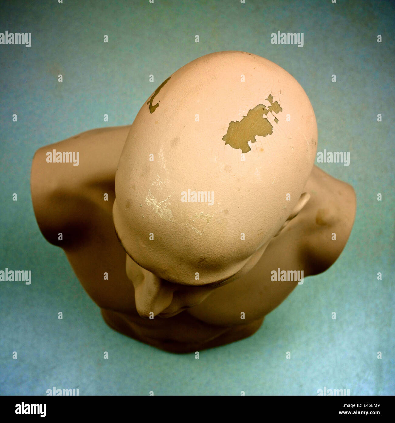 High angle view of a weathered mannequin with visible wear Stock Photo ...