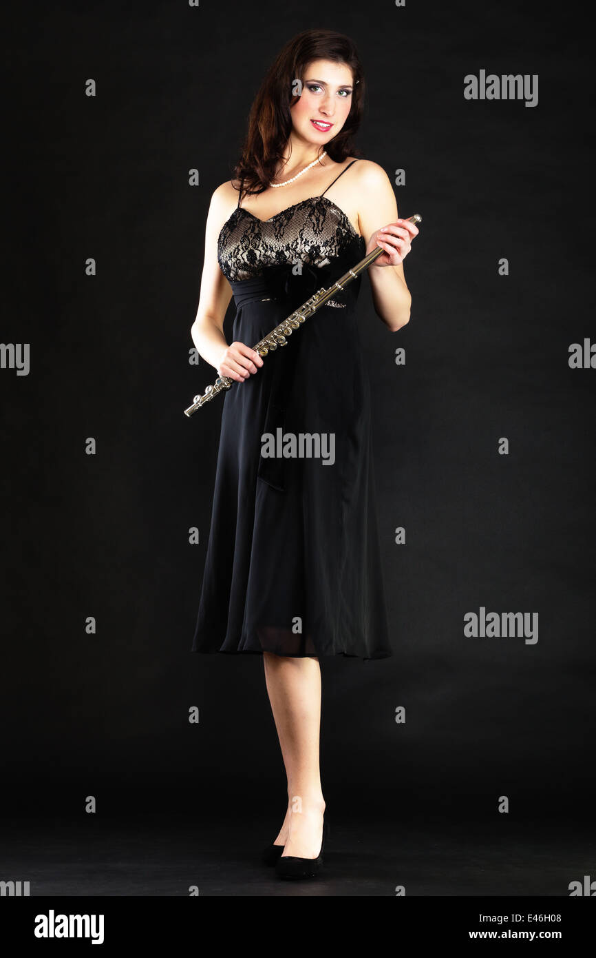 Art and artist. Full length of woman girl flutist flautist performer ...