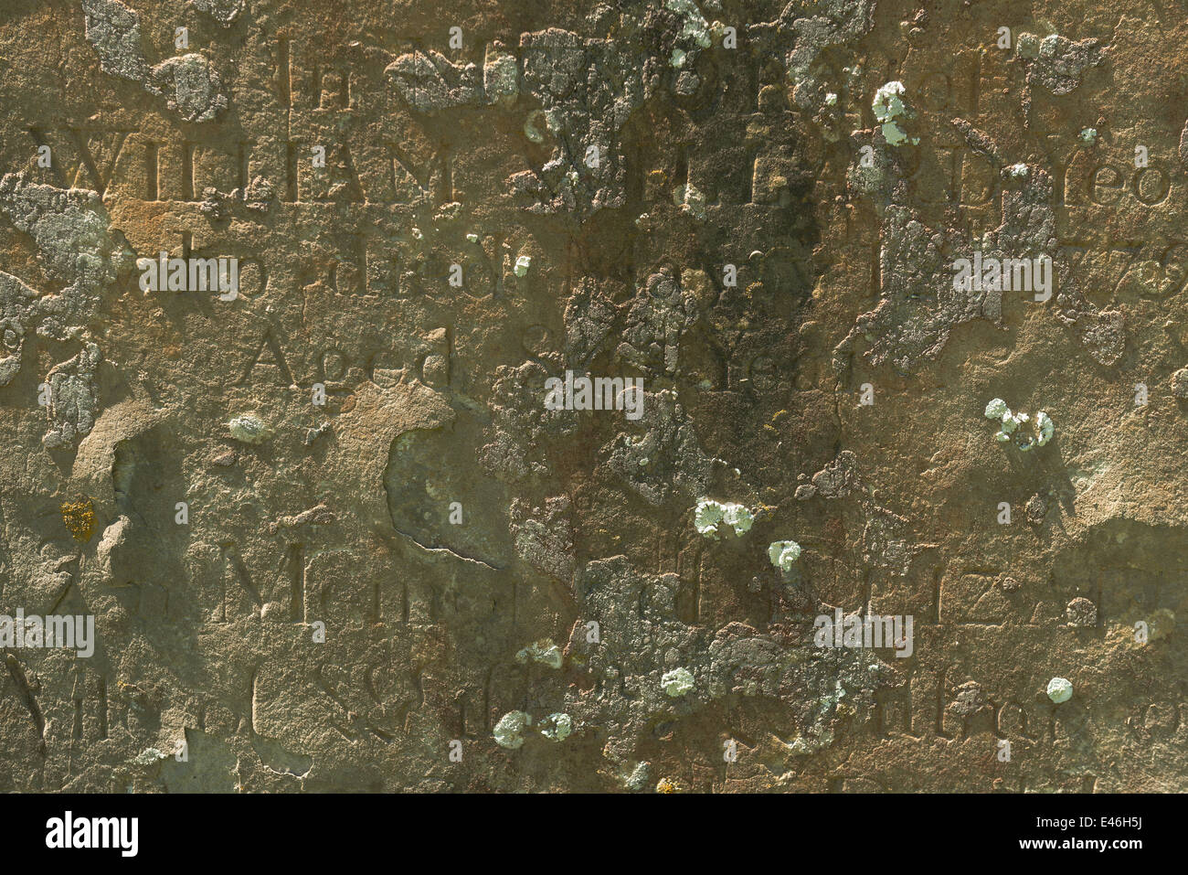 Old weathered and eroded flaking sandstone head stone carved and ...