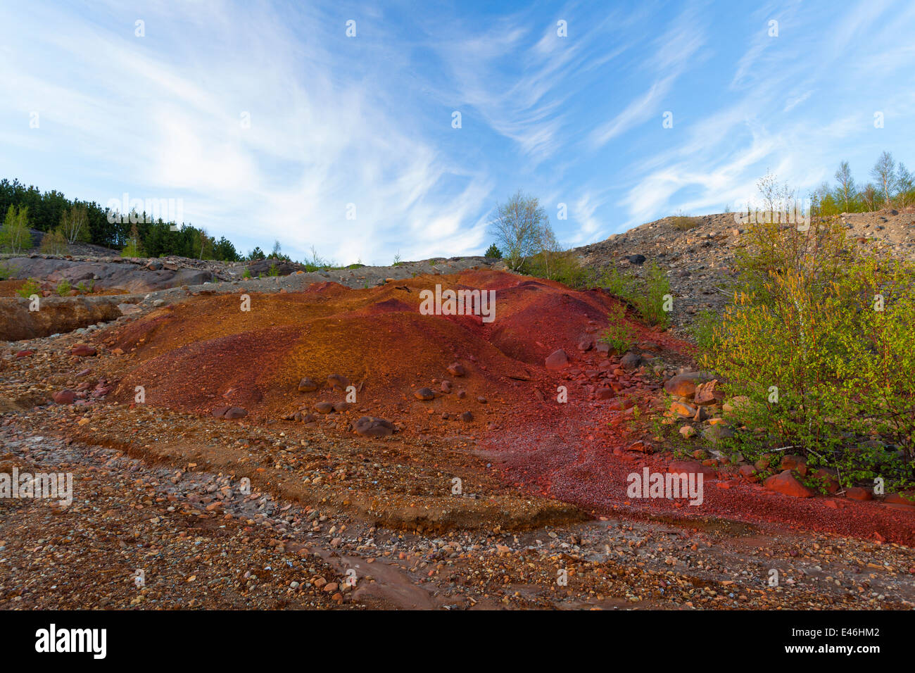 Rock and soil turn strong rusty, red, purple and brown colours as ...