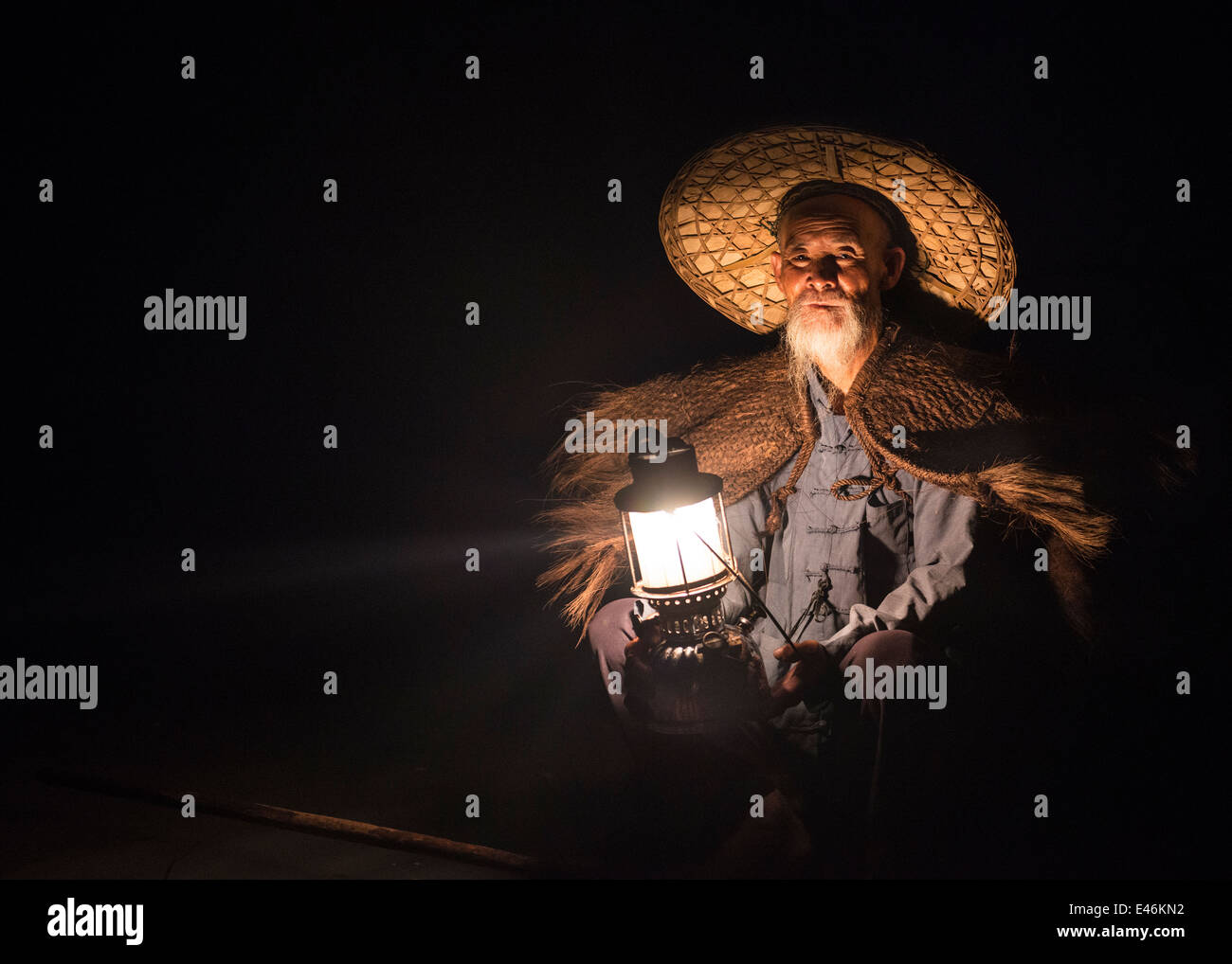 Cormorant fisherman and his bird on the Li River in Yangshuo, Guangxi ...