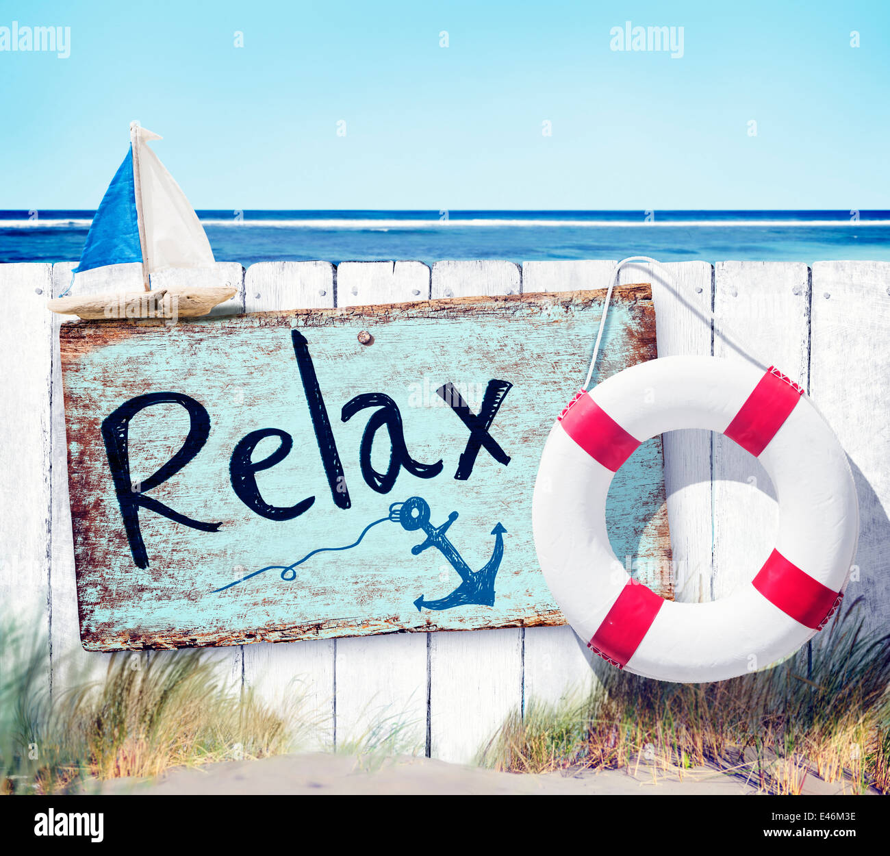 Wooden Fence and Relax Sign Board on Beach Stock Photo - Alamy