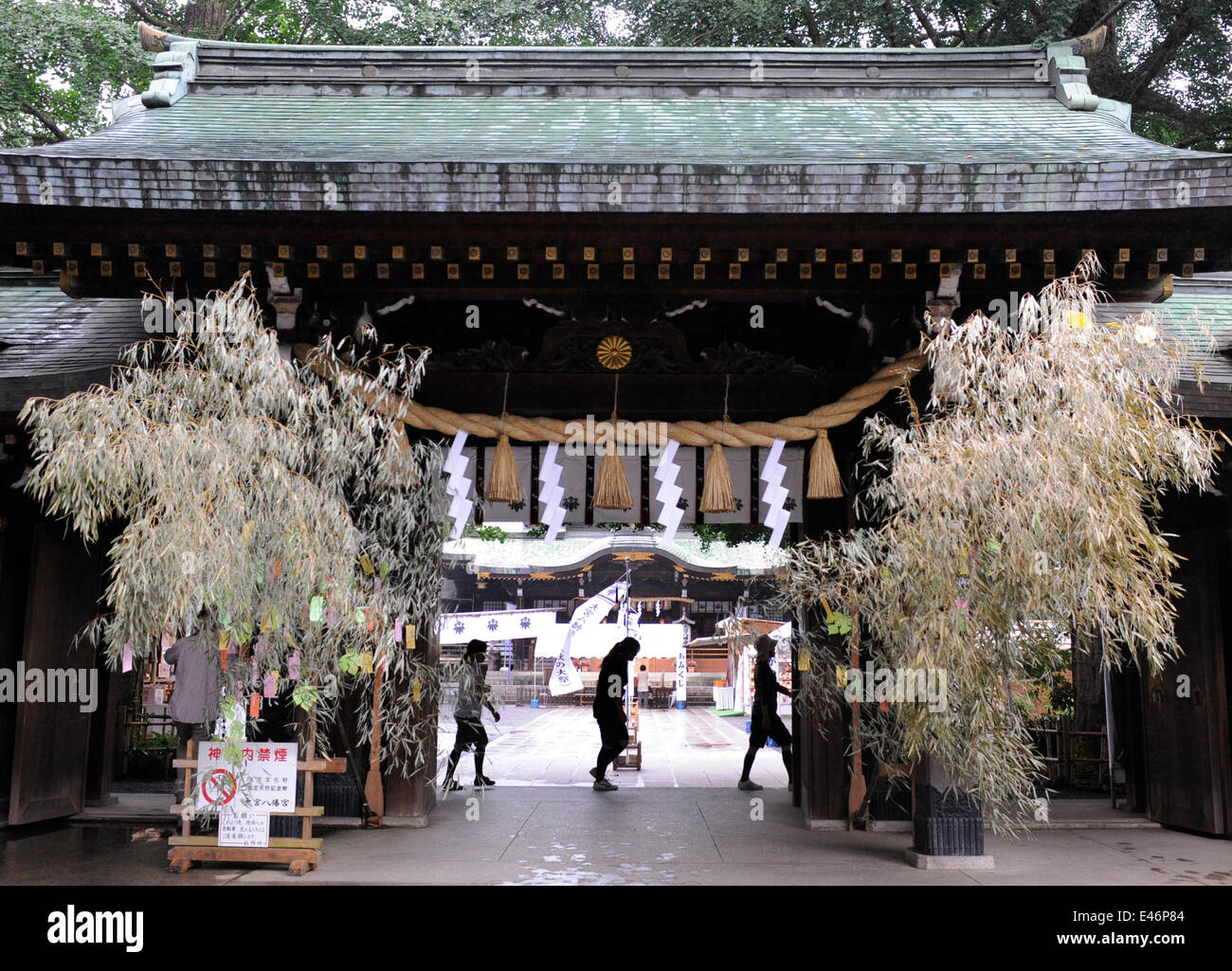 Tokyo, Japan. 4th July, 2014. Bamboos are tied with strips of paper ...