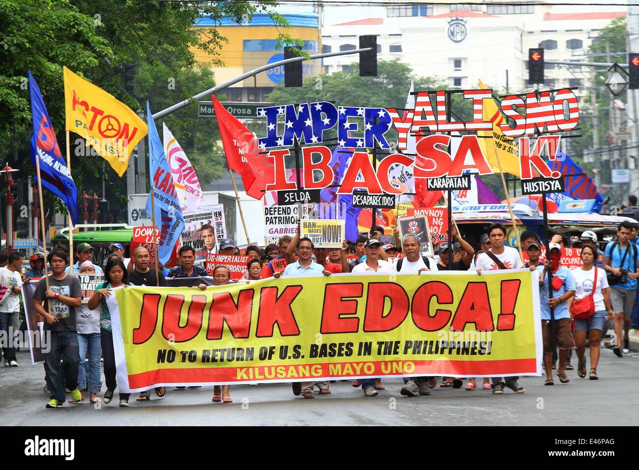 Manila, Philippines. 4th July, 2014. Activists march during a protest ...