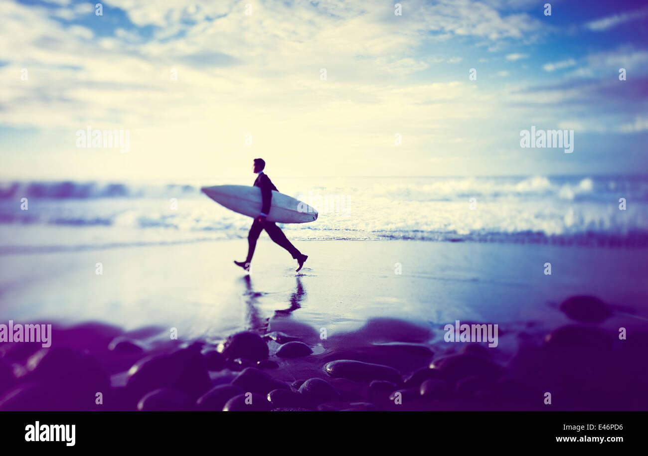 Lone Businessman by the Beach with Surfboard Stock Photo - Alamy