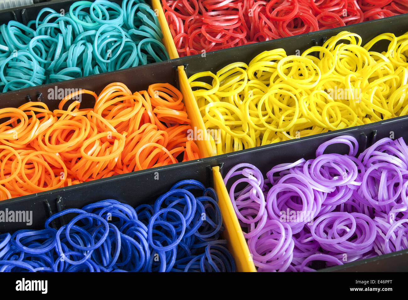 Colorful Rainbow loom rubber bands in a box Stock Photo - Alamy