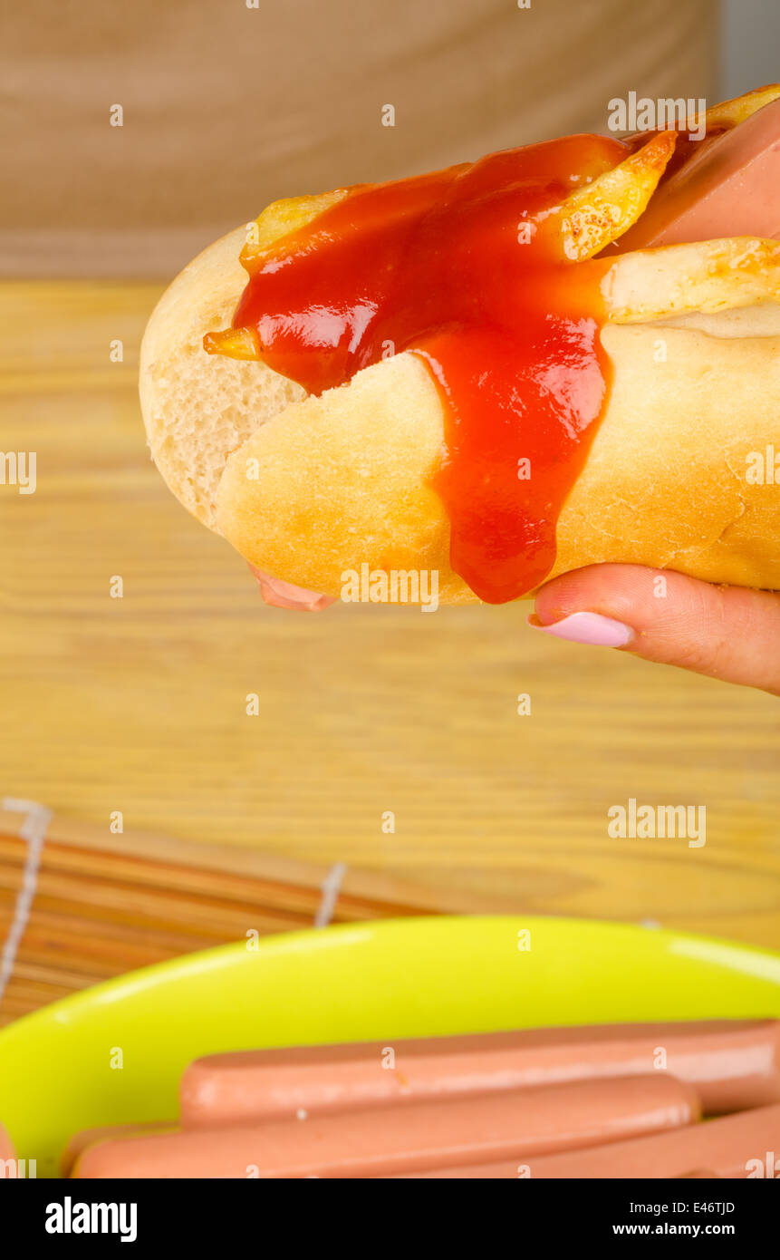 Female hands holding hot dog hi-res stock photography and images - Alamy