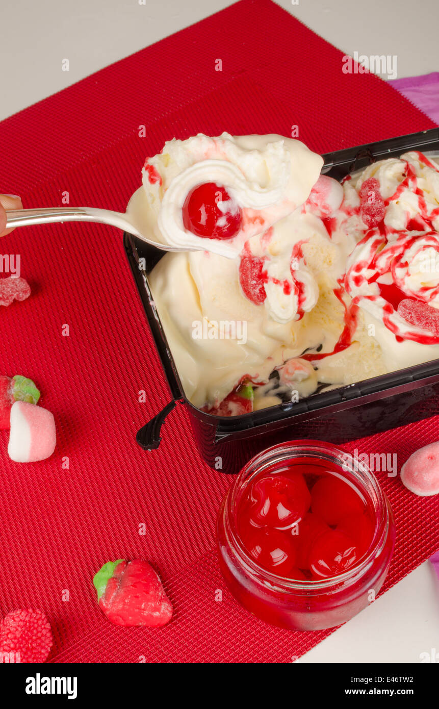 Lots of cream on top of a portion of cloying ice cream Stock Photo - Alamy