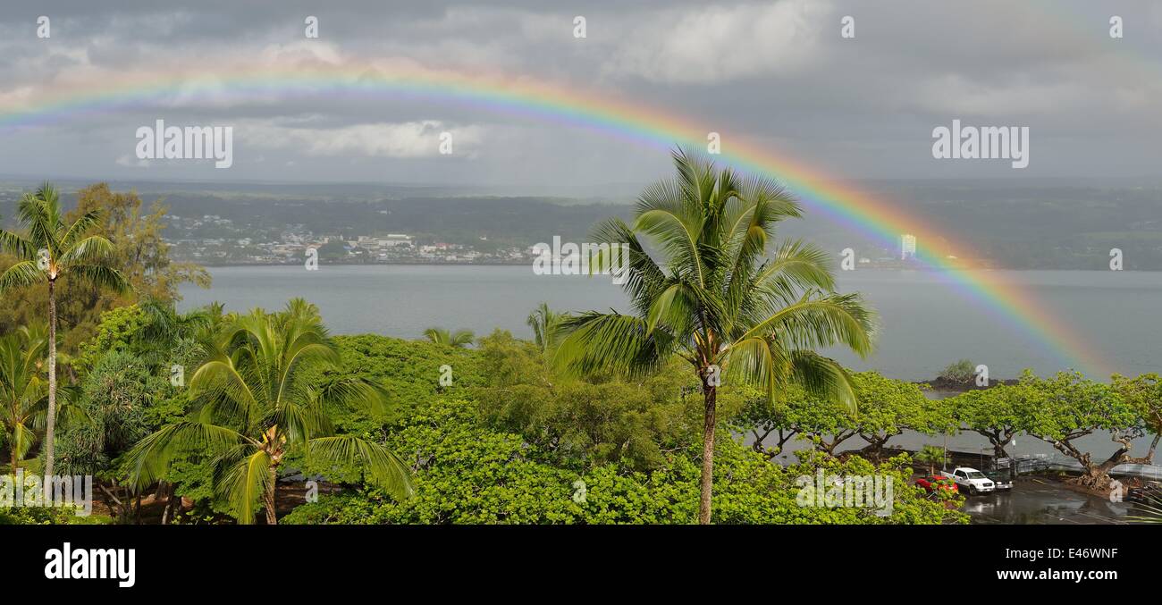 A rainbow appears during a rain shower in the bay of Hilo (Hawaii Stock ...