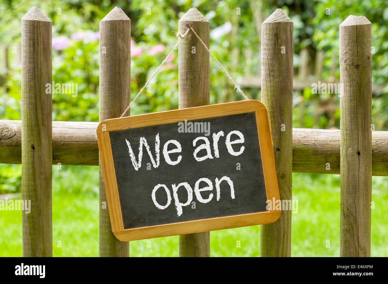 Blackboard with the inscription We are open Stock Photo - Alamy