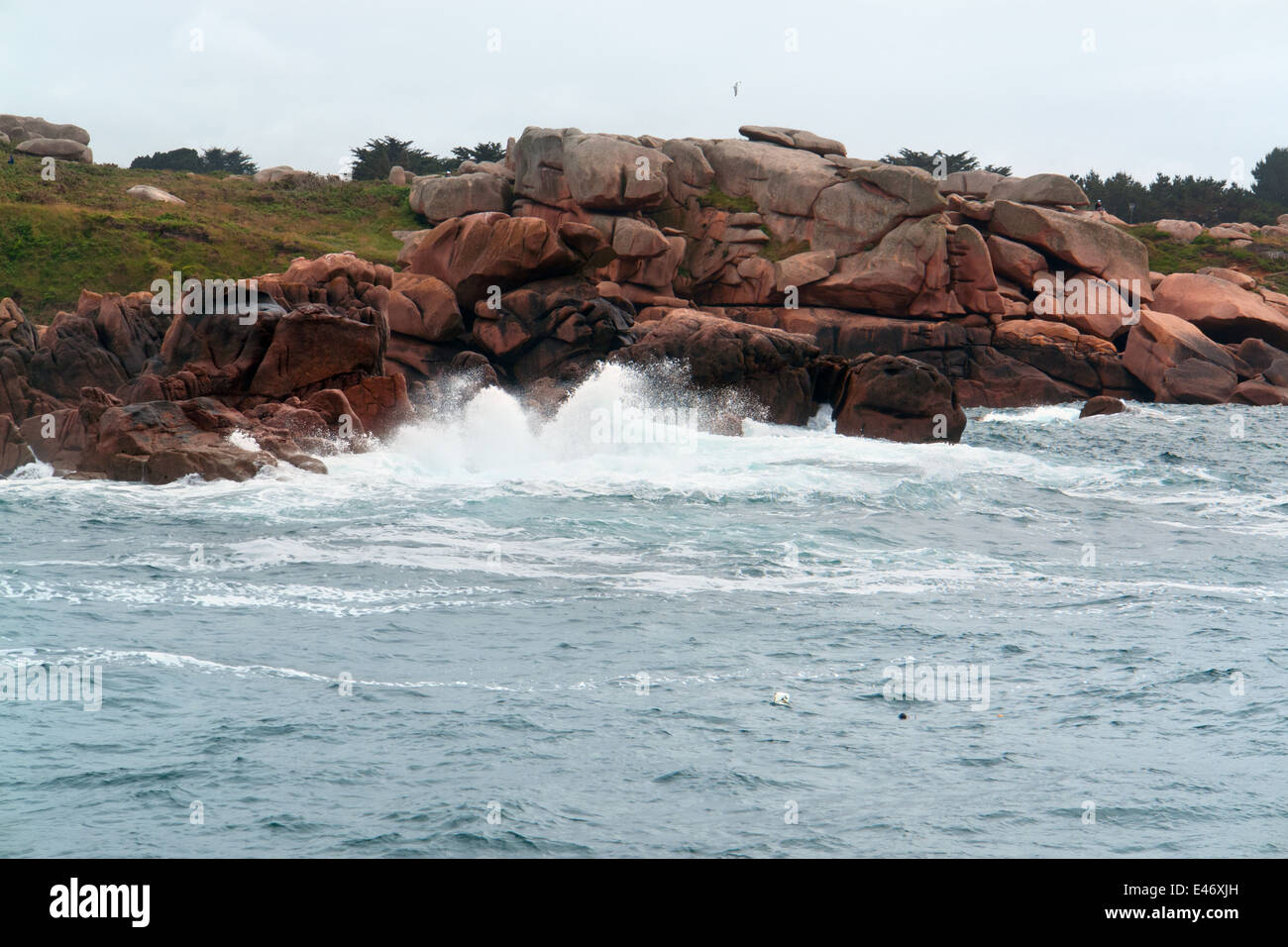 rocky and clefty coastal detail at the Pink Granite coast in Brittany ...