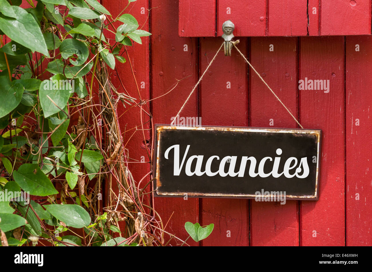 Old metal sign with the inscription Vacancies Stock Photo - Alamy