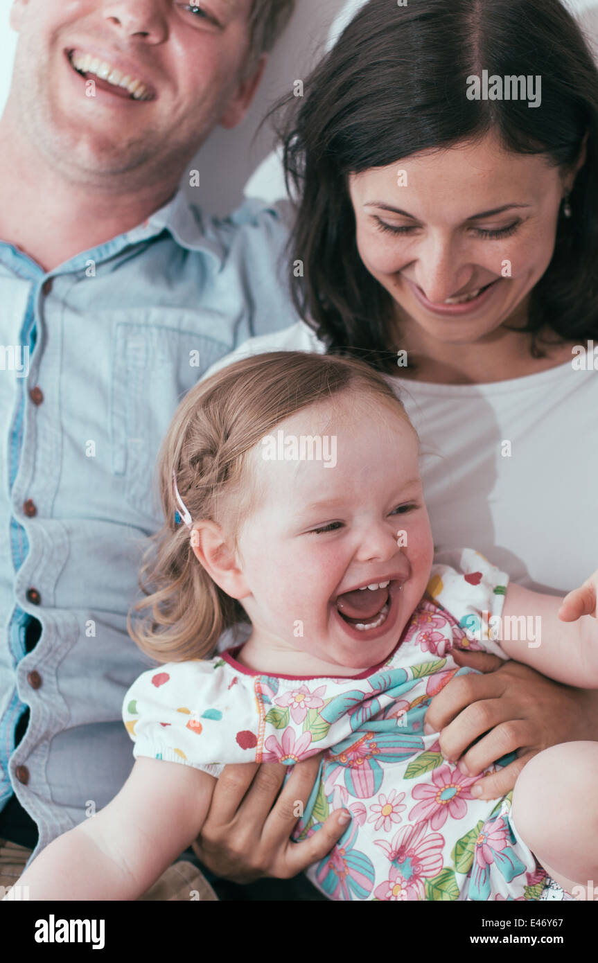 Happy family having fun Stock Photo - Alamy
