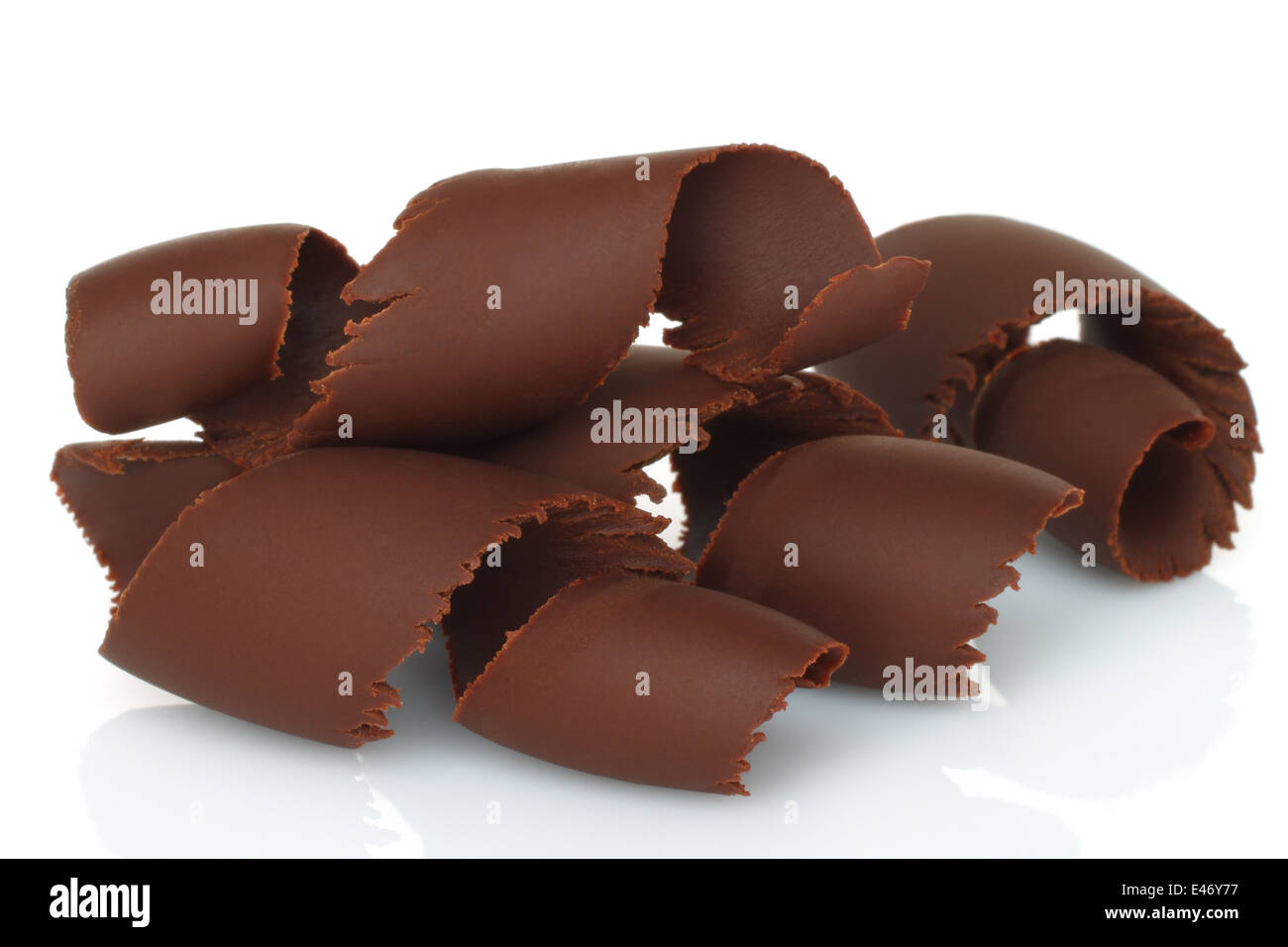 Chocolate shavings on white background Stock Photo - Alamy