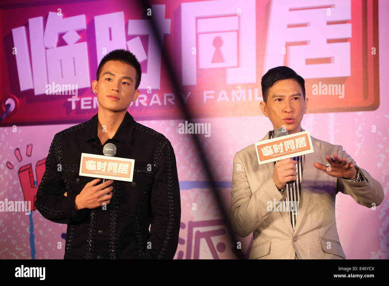 Beijing, China. 3rd July, 2014. Actor Nick Cheung (R) and singer Oho Ou ...