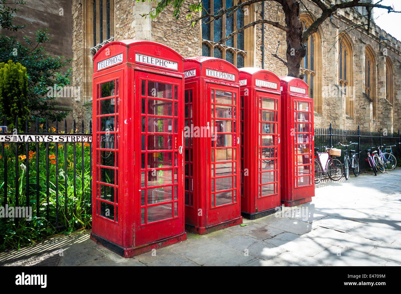 Row of red vintage British telephone boxes Stock Photo - Alamy