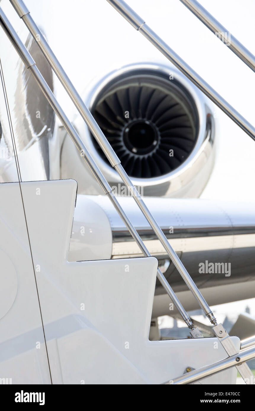 Stairs with Jet Engine on a modern private jet airplane - Bombardier ...