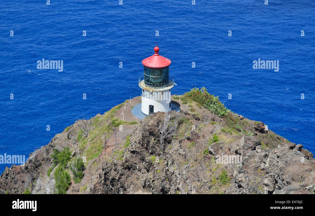 A lighthouse stands on a rock at the Makapuu Beach Park near Honolulu ...