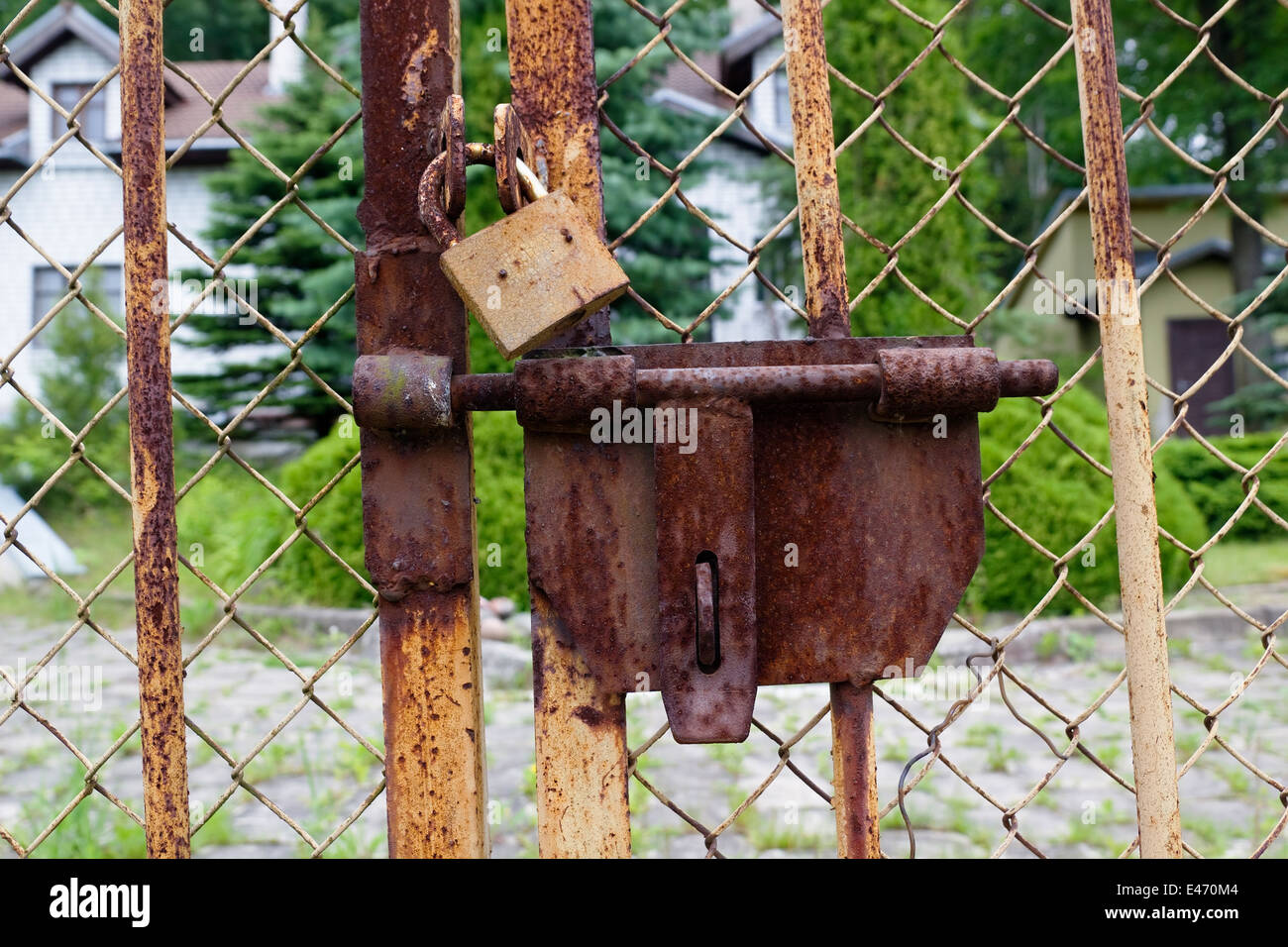 The old thrown country house is closed on rusty locks. Selective art ...