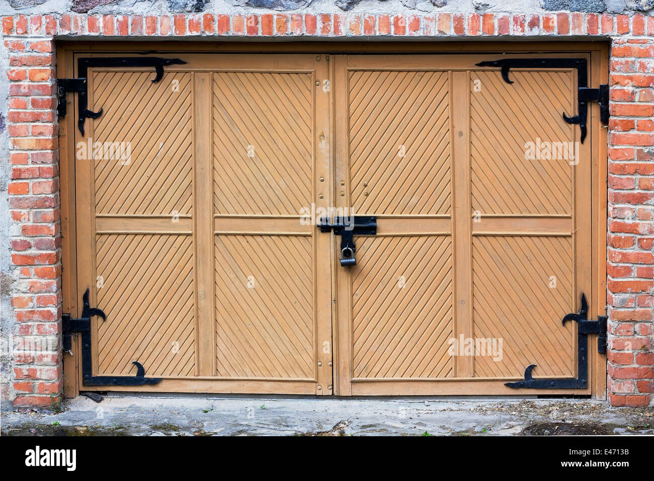 Yellow vintage retro style gates in the red brick house background ...