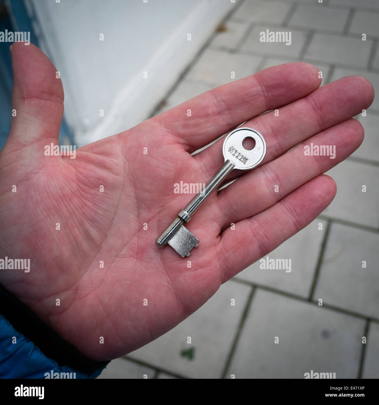 A mortice lock key in the palm of a man's hand Stock Photo - Alamy