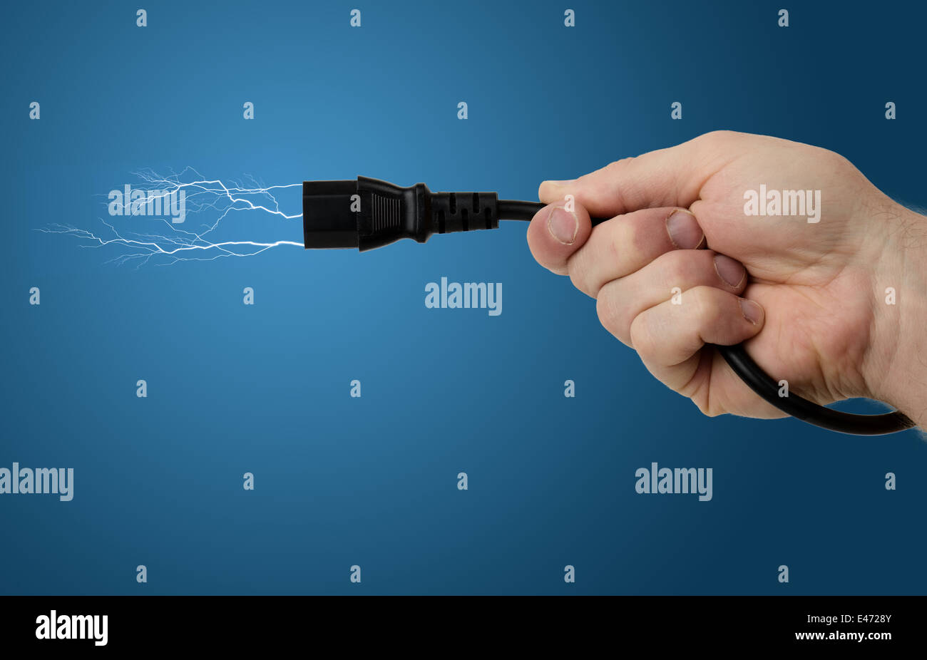 wireless power a hand holding a plug with electricity firing from the ...