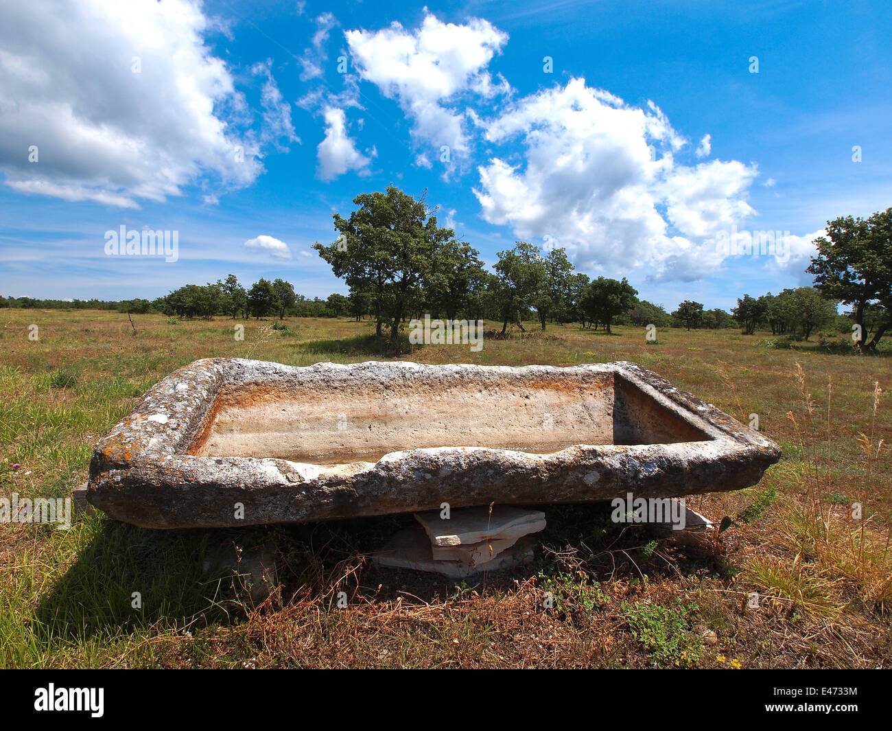 old stone made watering place for cattle Stock Photo - Alamy