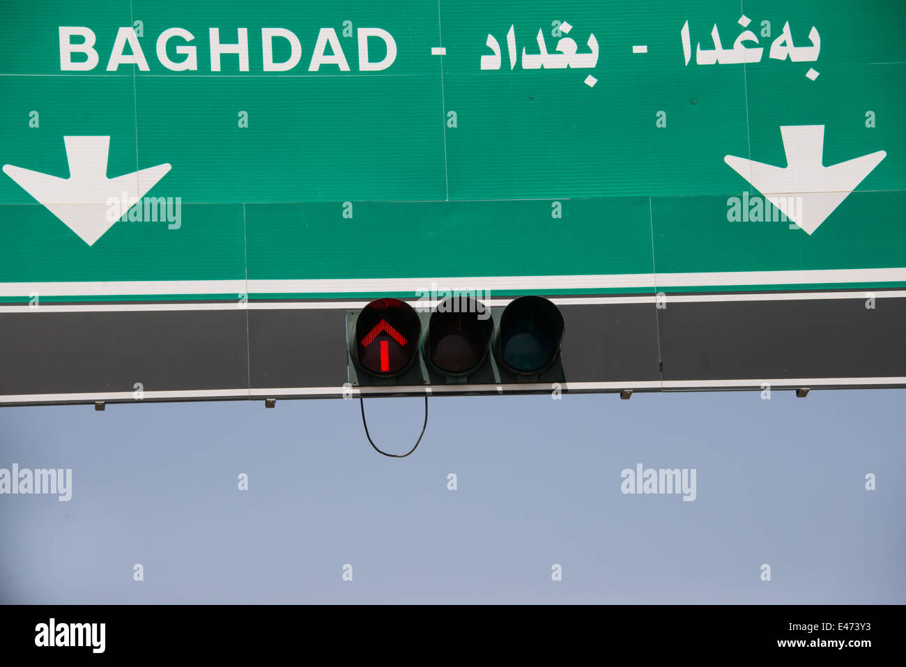 A road sign points toward Baghdad in the city of Duhok, Ninevah ...