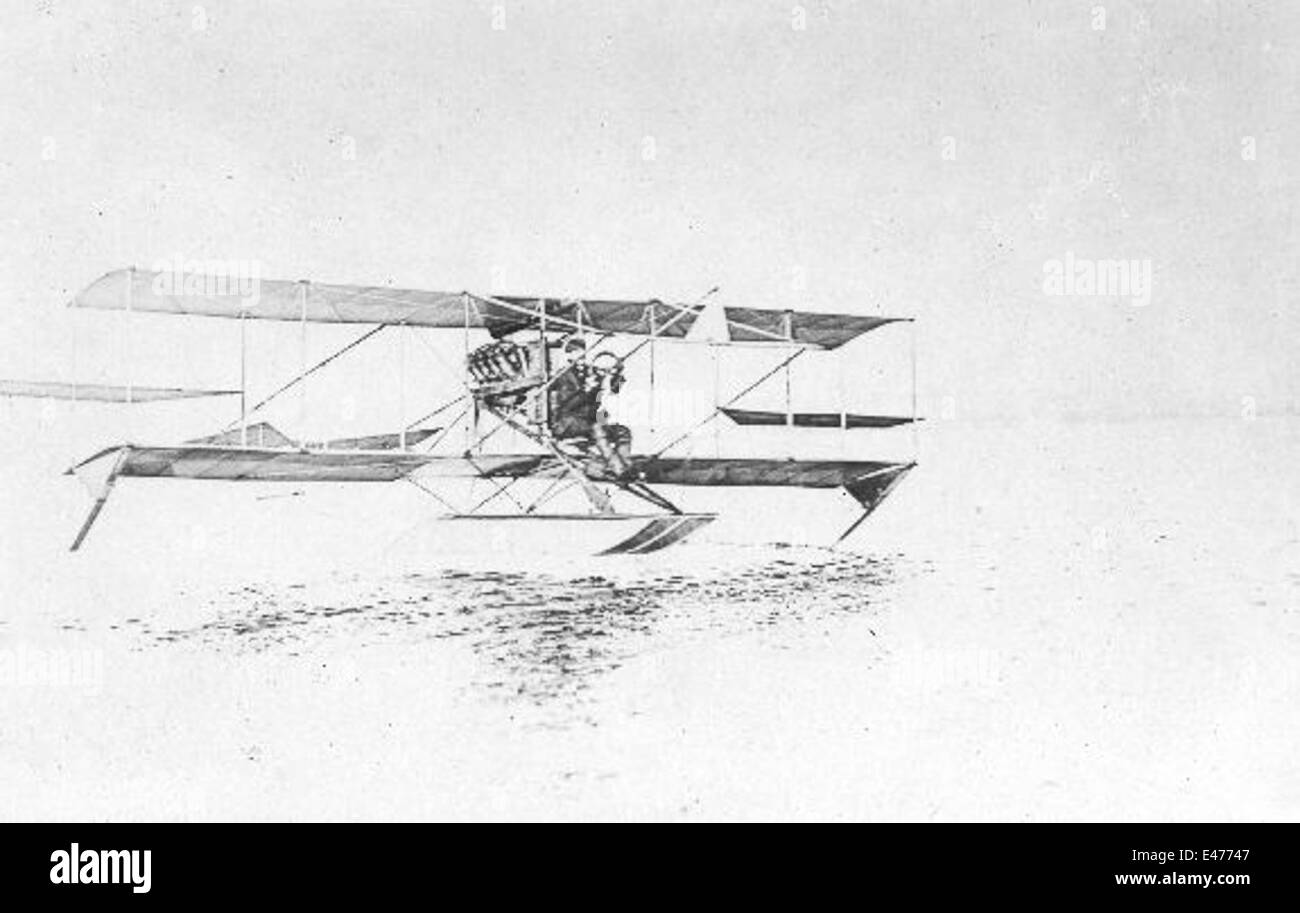 This image features a Curtiss aircraft from the early days of flight ...