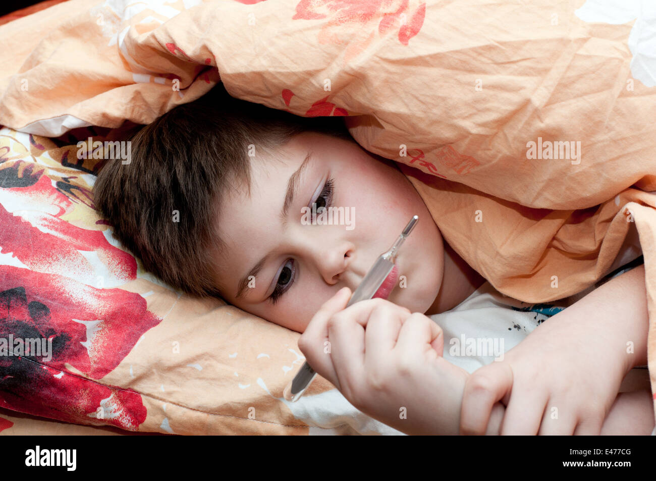 boy alone sick sickness colds thermometer scarf fever flu bed lies ...