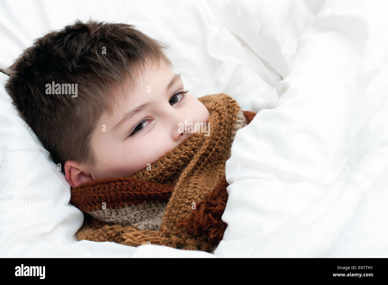 boy alone sick sickness colds thermometer scarf fever flu bed lies ...