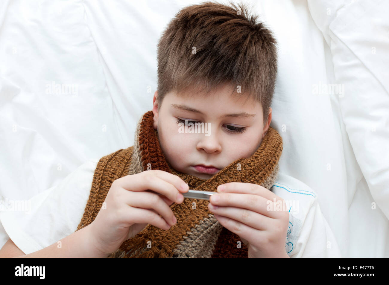 boy sick sickness colds thermometer scarf fever flu bed lies lying 8 ...