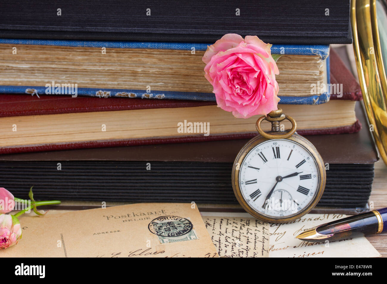 antique clock with old books and letters background Stock Photo - Alamy