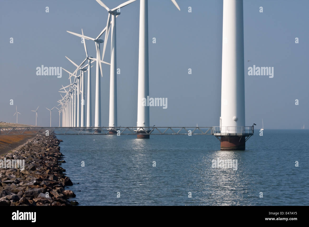 Long row of windmills standing in Dutch sea Stock Photo - Alamy