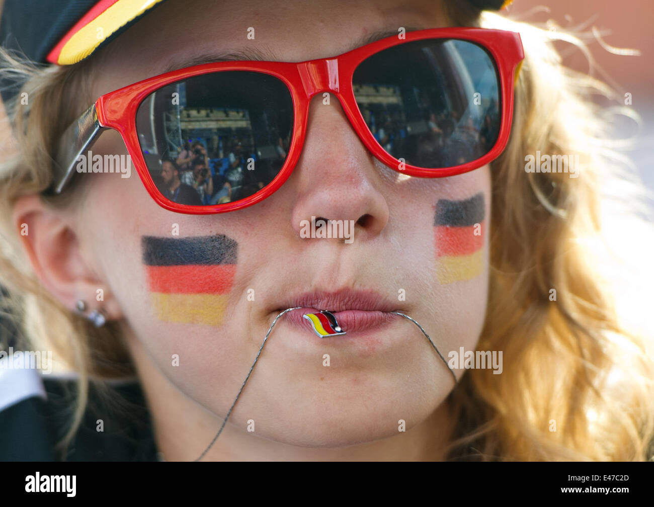 Berlin, Germany. 04th July, 2014. A soccer fan is pictured while she ...